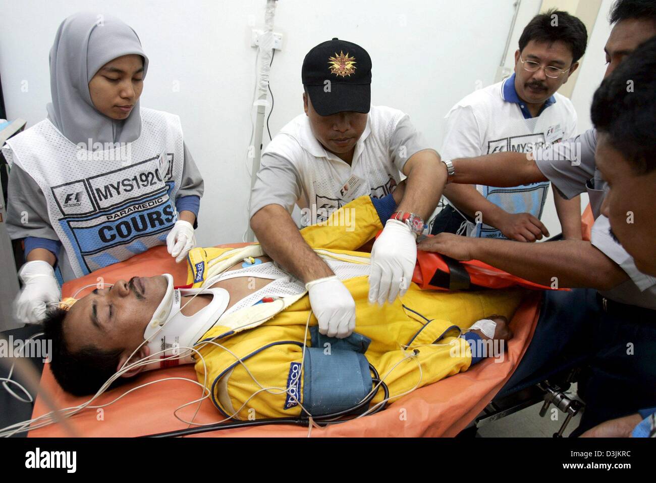(dpa) - Race doctors and nurses treat a simulating patient during a ...