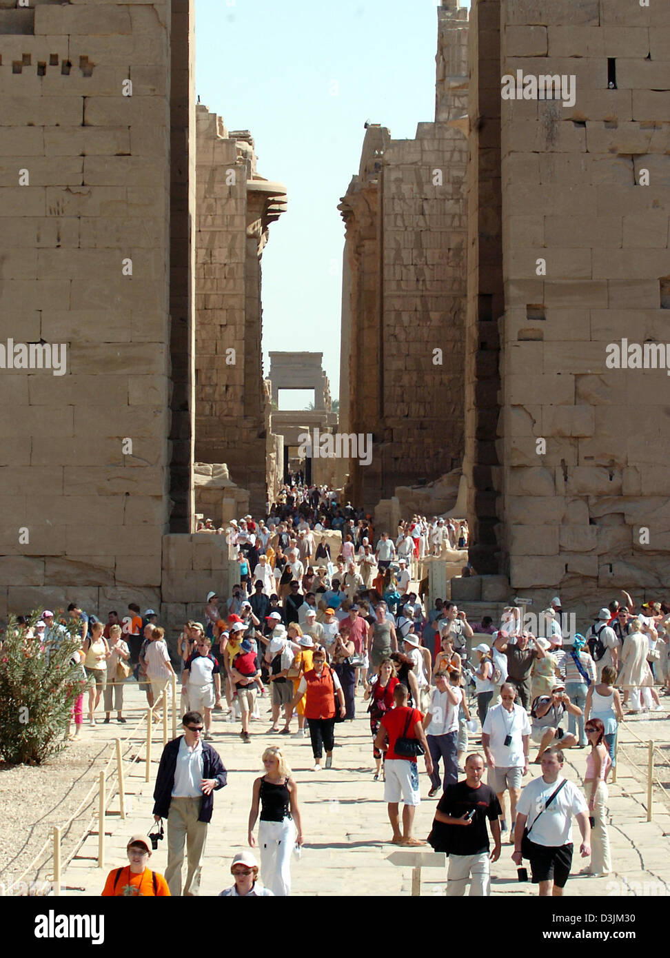 Tourists walk through village hi-res stock photography and images - Alamy