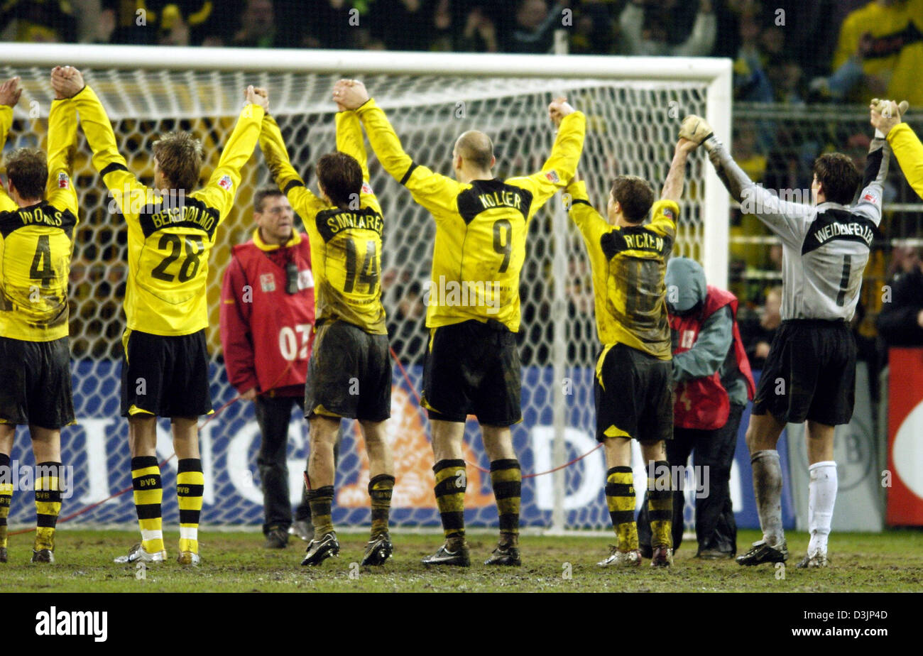(dpa) - Players of Borussia Dortmund celebrate with their fans after ...