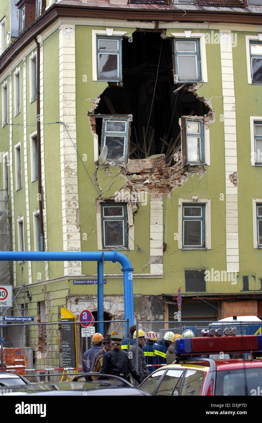 (dpa) - A large hole can be seen in the outside wall of a residential ...