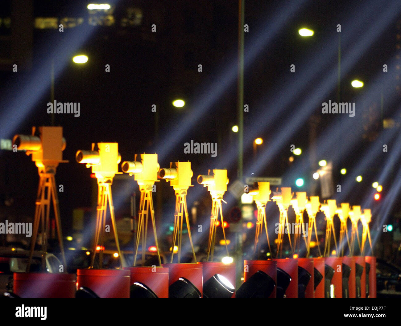 (dpa) - 'Golden Cameras' which are illuminated by floodlights stands in ...