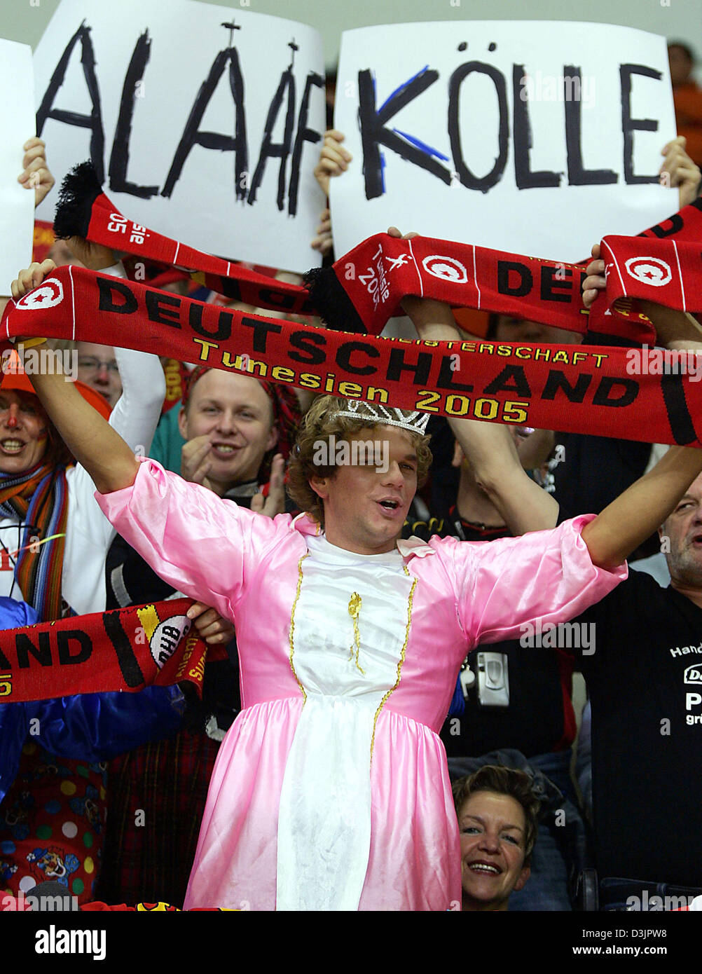 (dpa) - German handball fans dressed in carnival costumes are in high ...