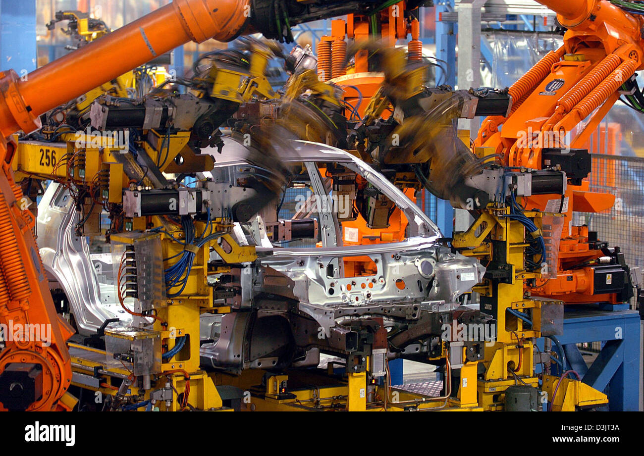 (dpa) - Robots assemble the body of a Ford Fusion model at the ...