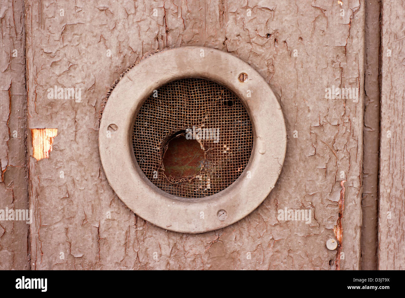 round hole in the wooden wall Stock Photo - Alamy