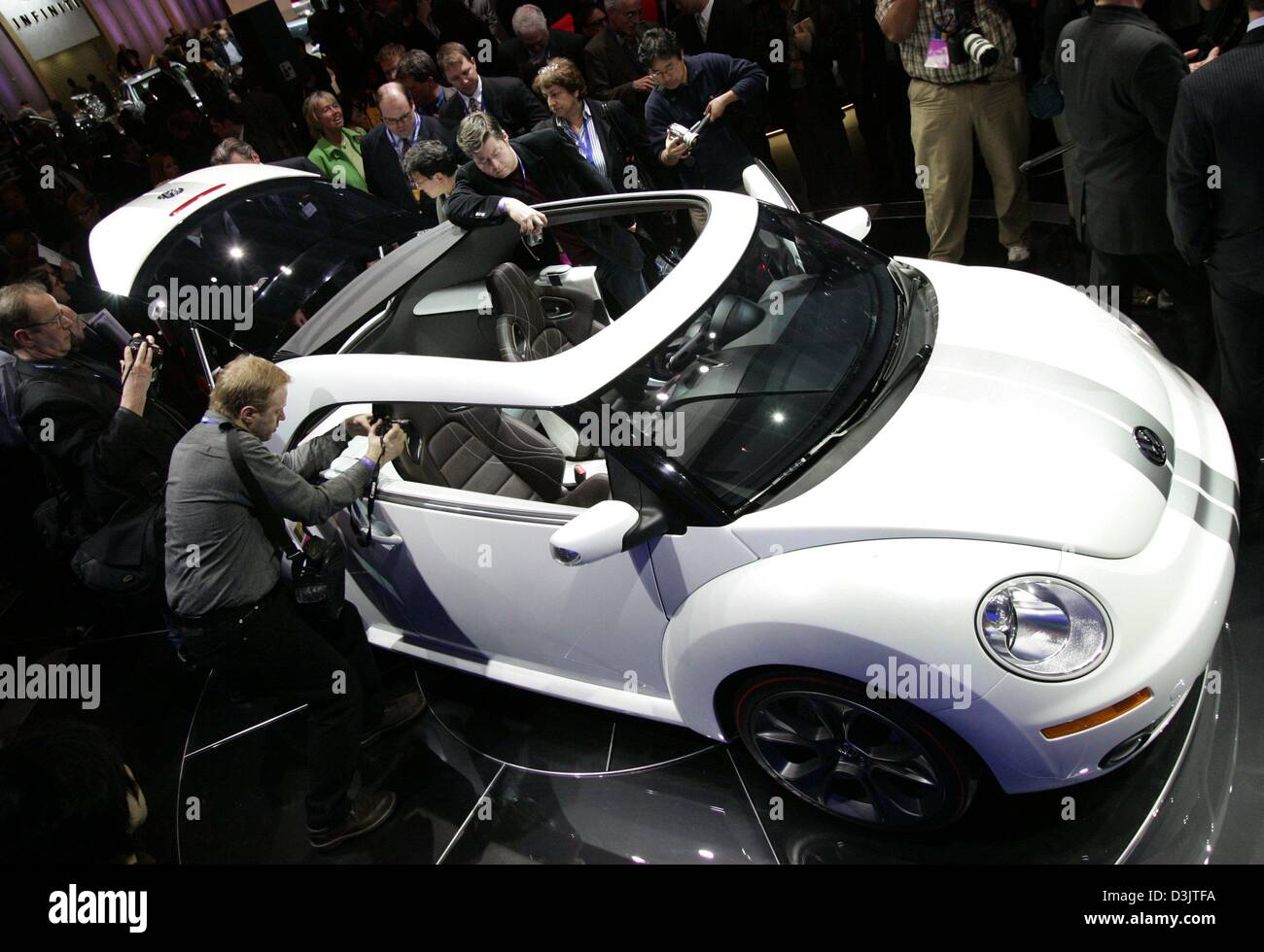 (dpa) - Visitors and photographers examine the new Beetle Ragster by ...
