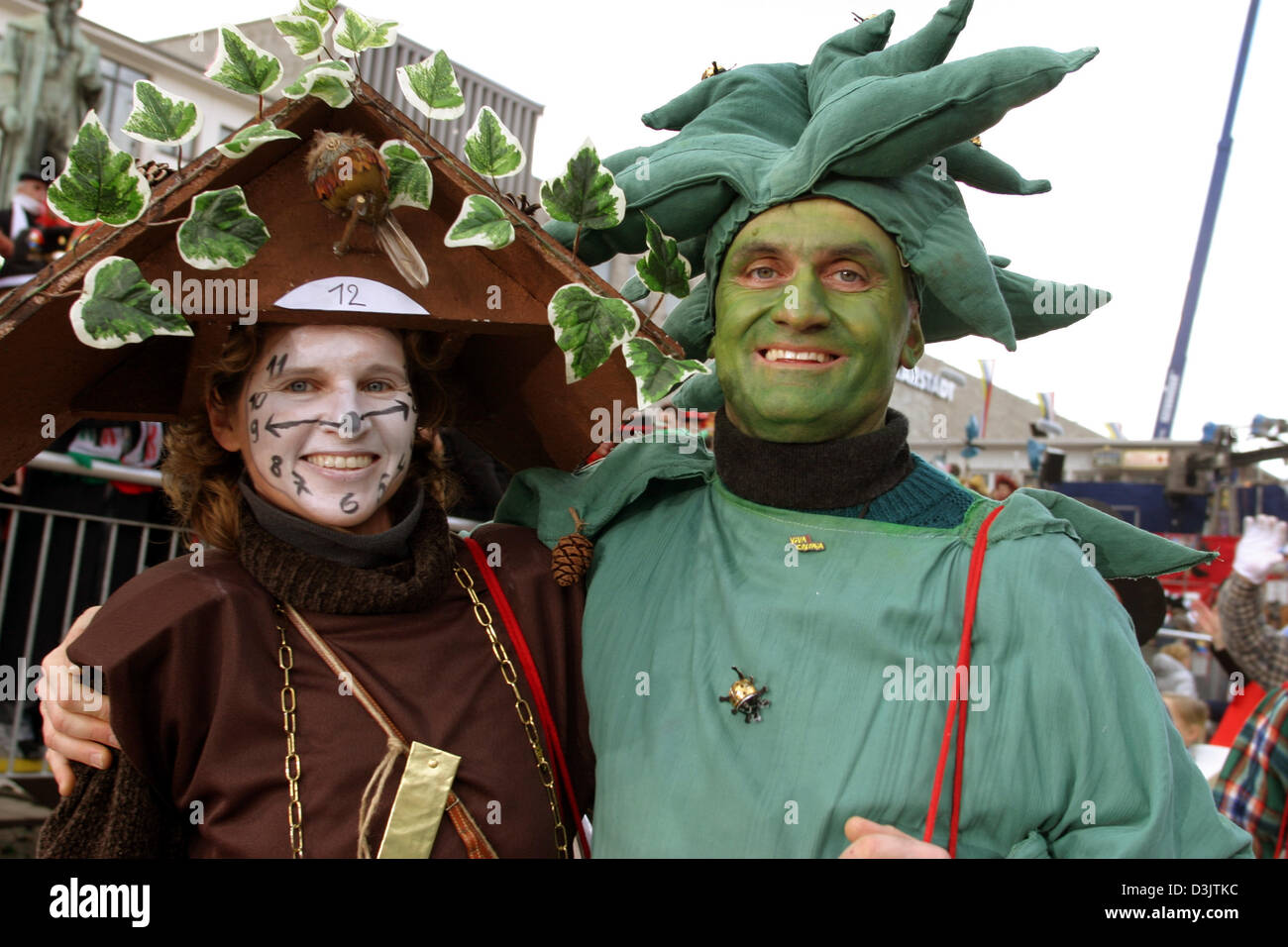 (dpa files) - Two people dressed up as a cuckoo's clock and a vegetable ...