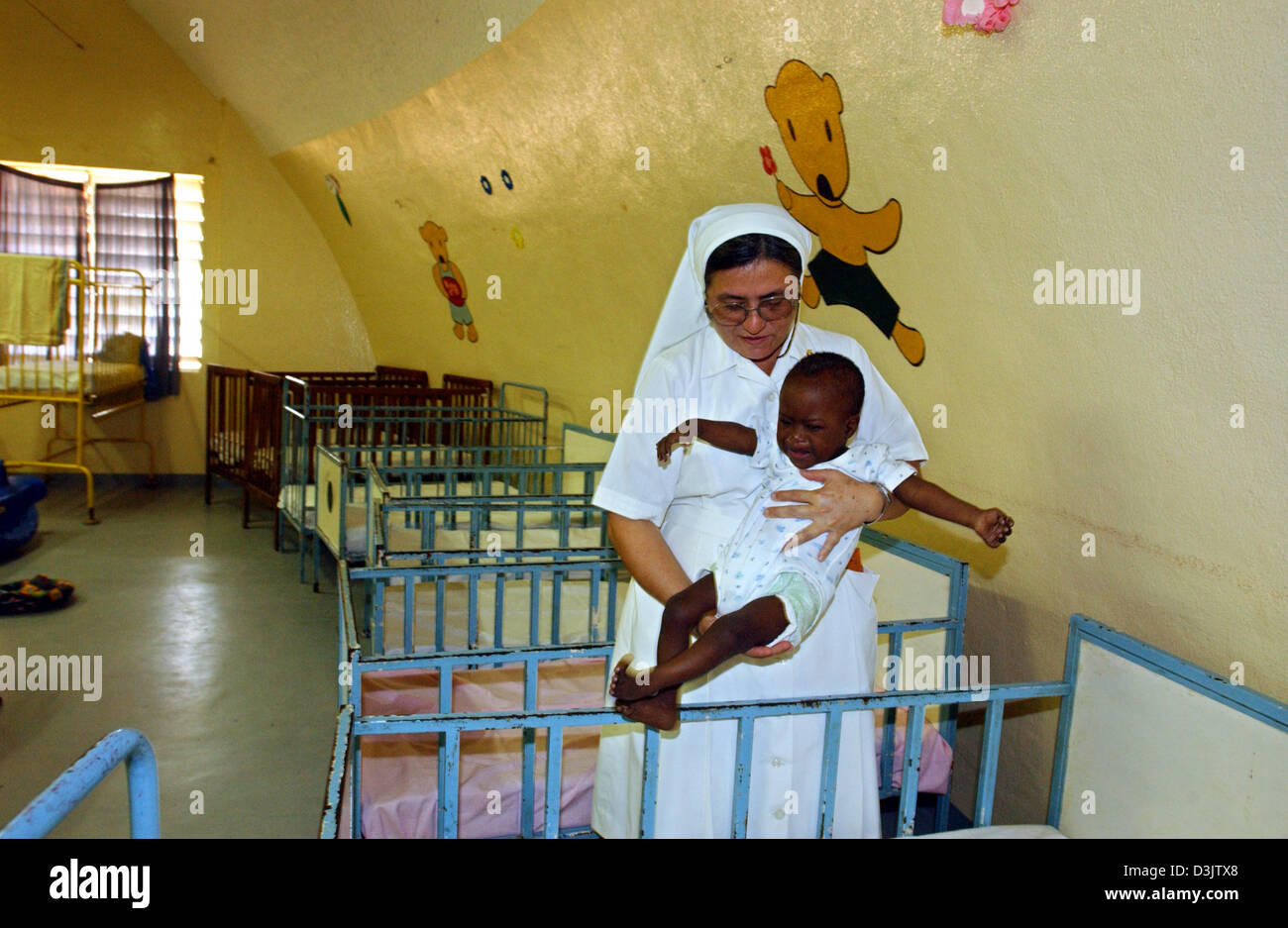 (dpa) - Sister Elsa holds seven-months-old Jocimar who suffers from the ...