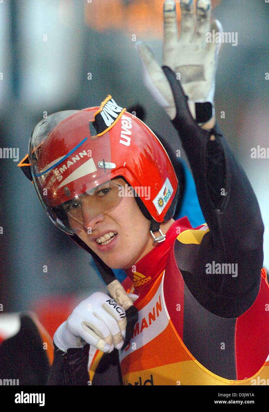 (dpa) - German luger David Moeller cheers and smiles after taking the ...
