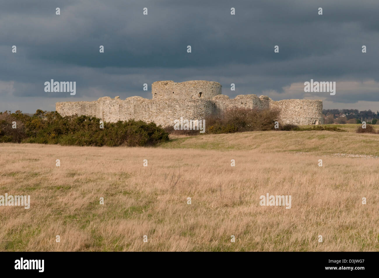 Camber Castle, Rye, East Sussex in sunshine with rolling storm clouds ...
