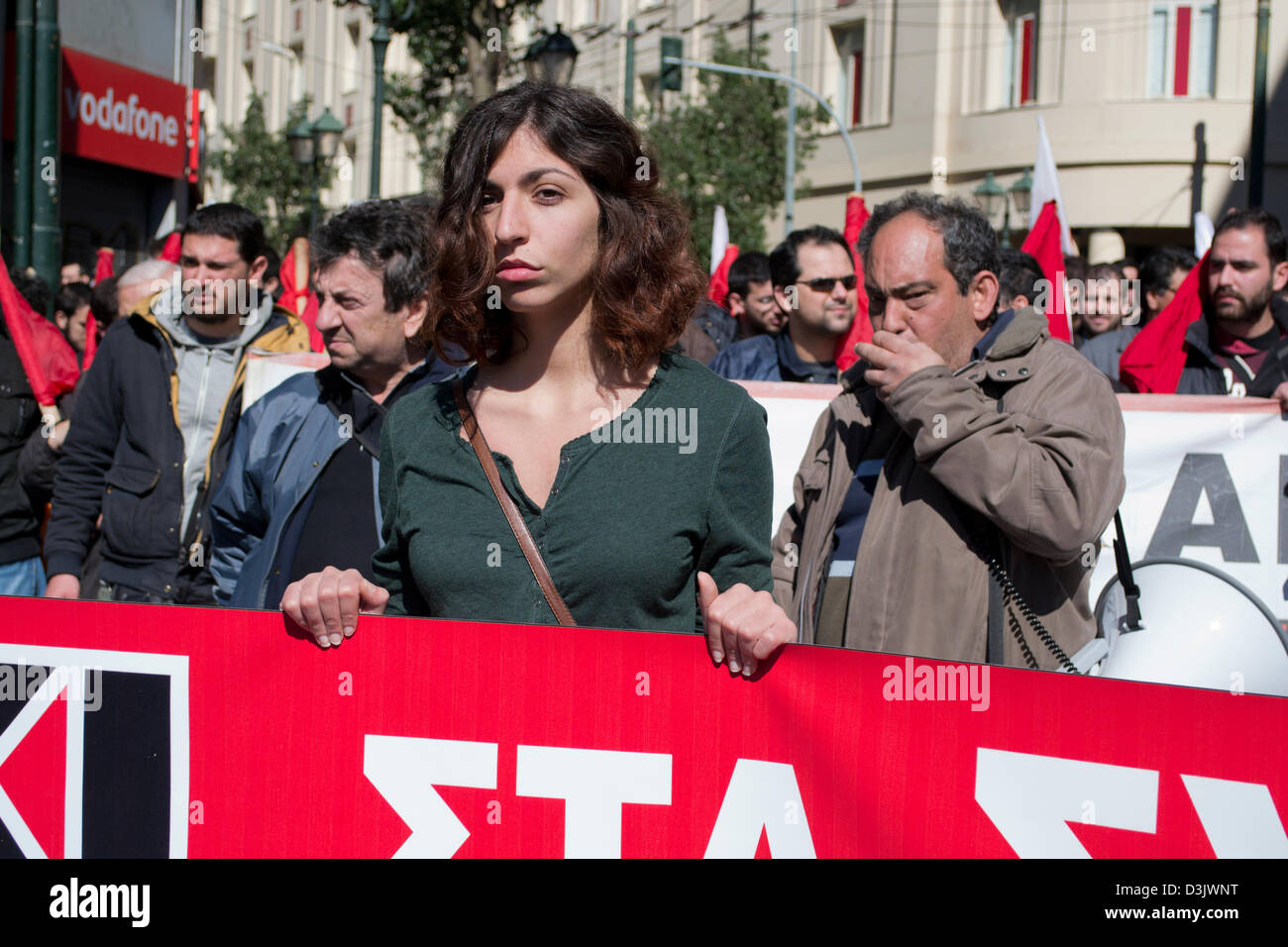 Close-up of young female protester holding banner Stock Photo - Alamy