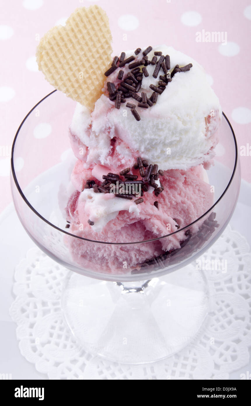 strawberry and vanilla ice cream with heart wafer Stock Photo - Alamy