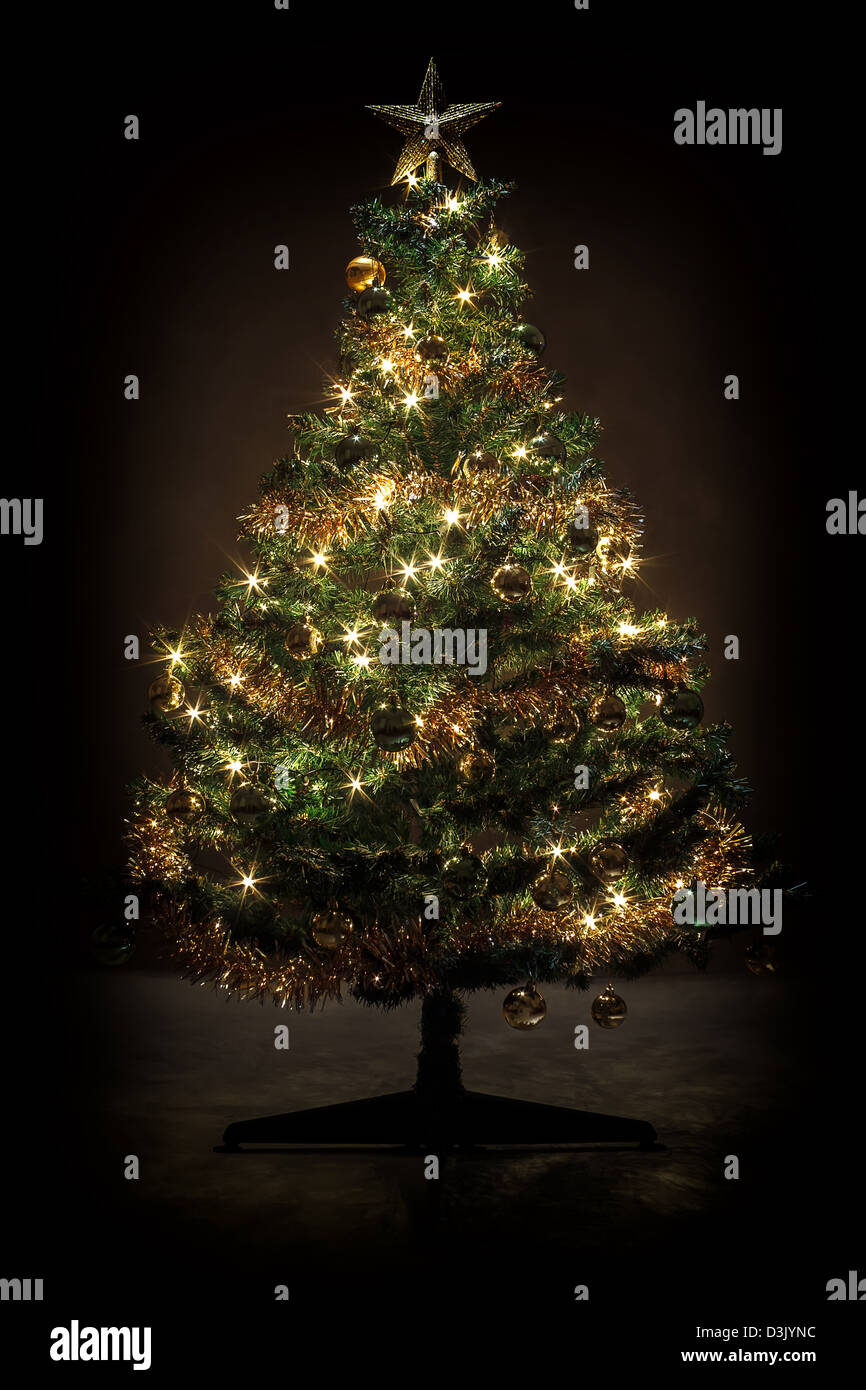 Decorated christmas tree with yellow and green balls Stock Photo - Alamy