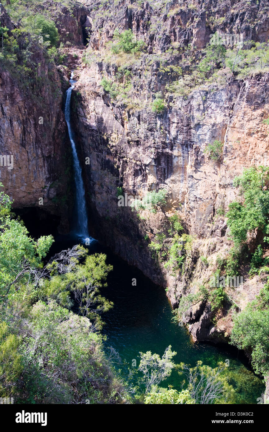 Tolmer Falls cascades over a high sandstone escarpment into a deep pool ...