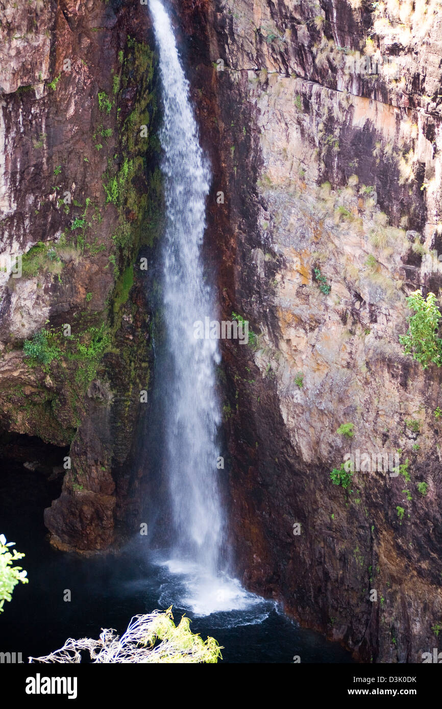 Tolmer Falls cascades over a high sandstone escarpment into a deep pool ...
