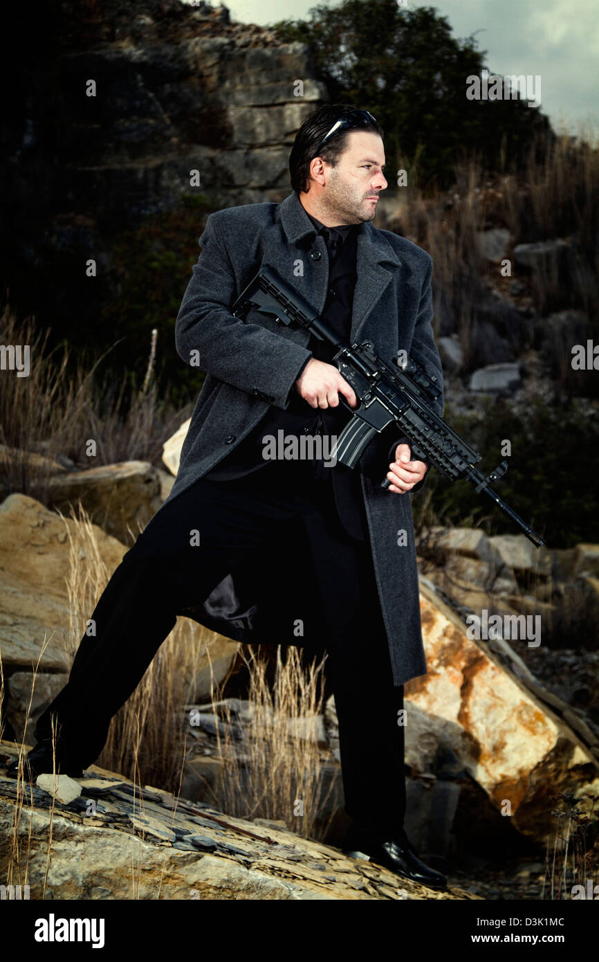 View of a contracted type killer agent wandering with a long jacket and ...