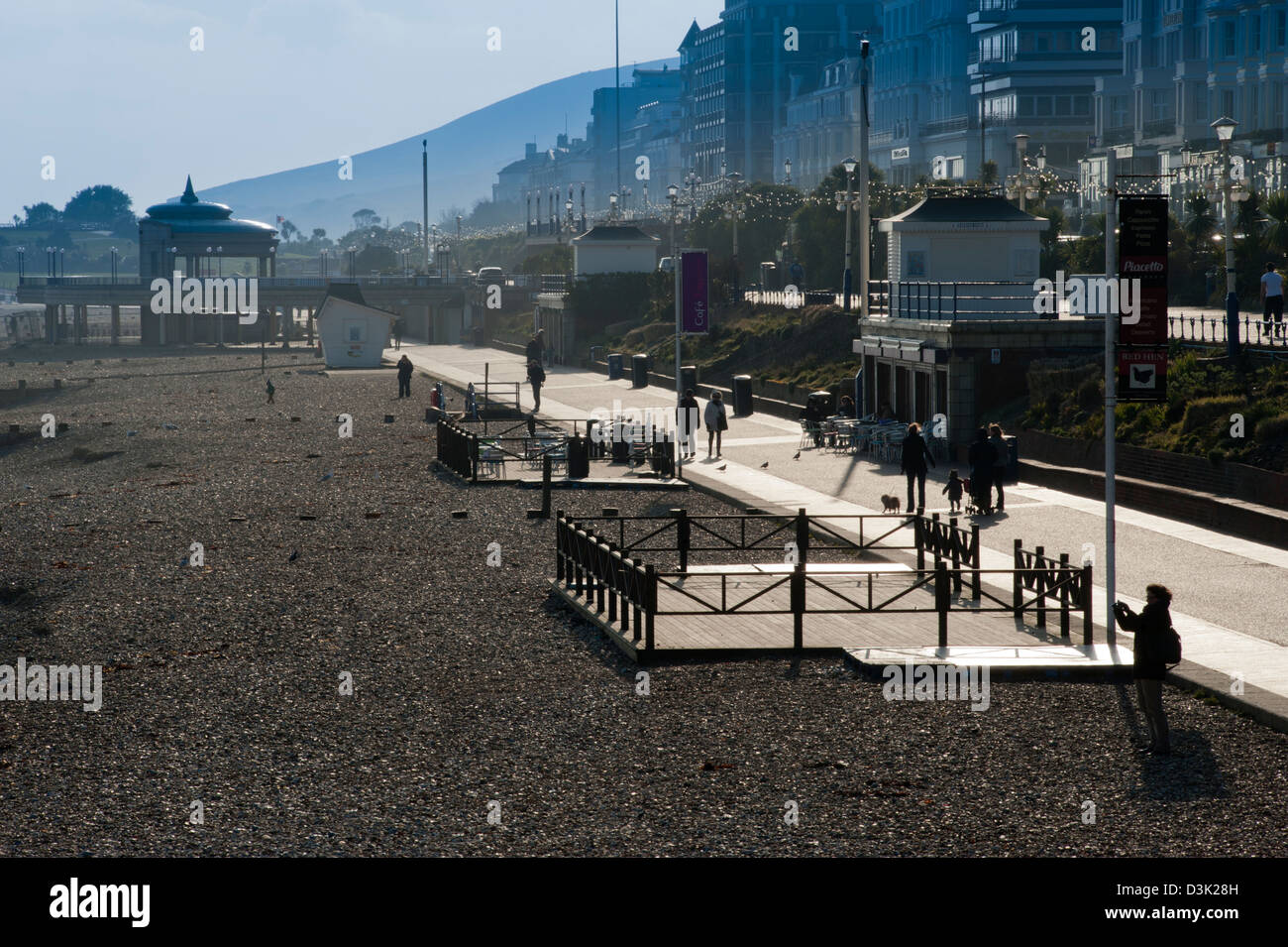 The quiet and empty promenade in winter at the seafront in Eastbourne ...