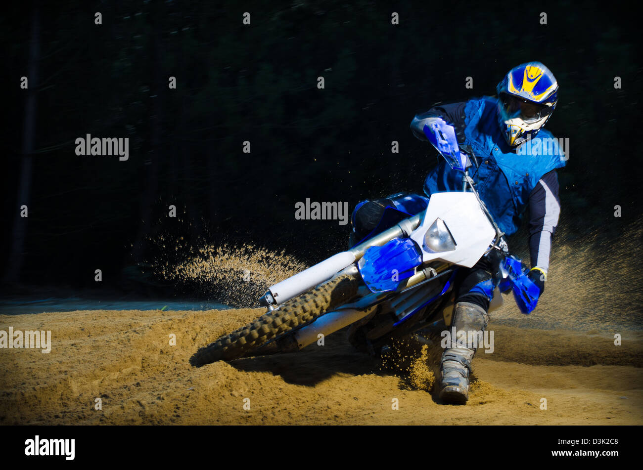 Enduro bike rider on action. Turn on sand terrain Stock Photo - Alamy