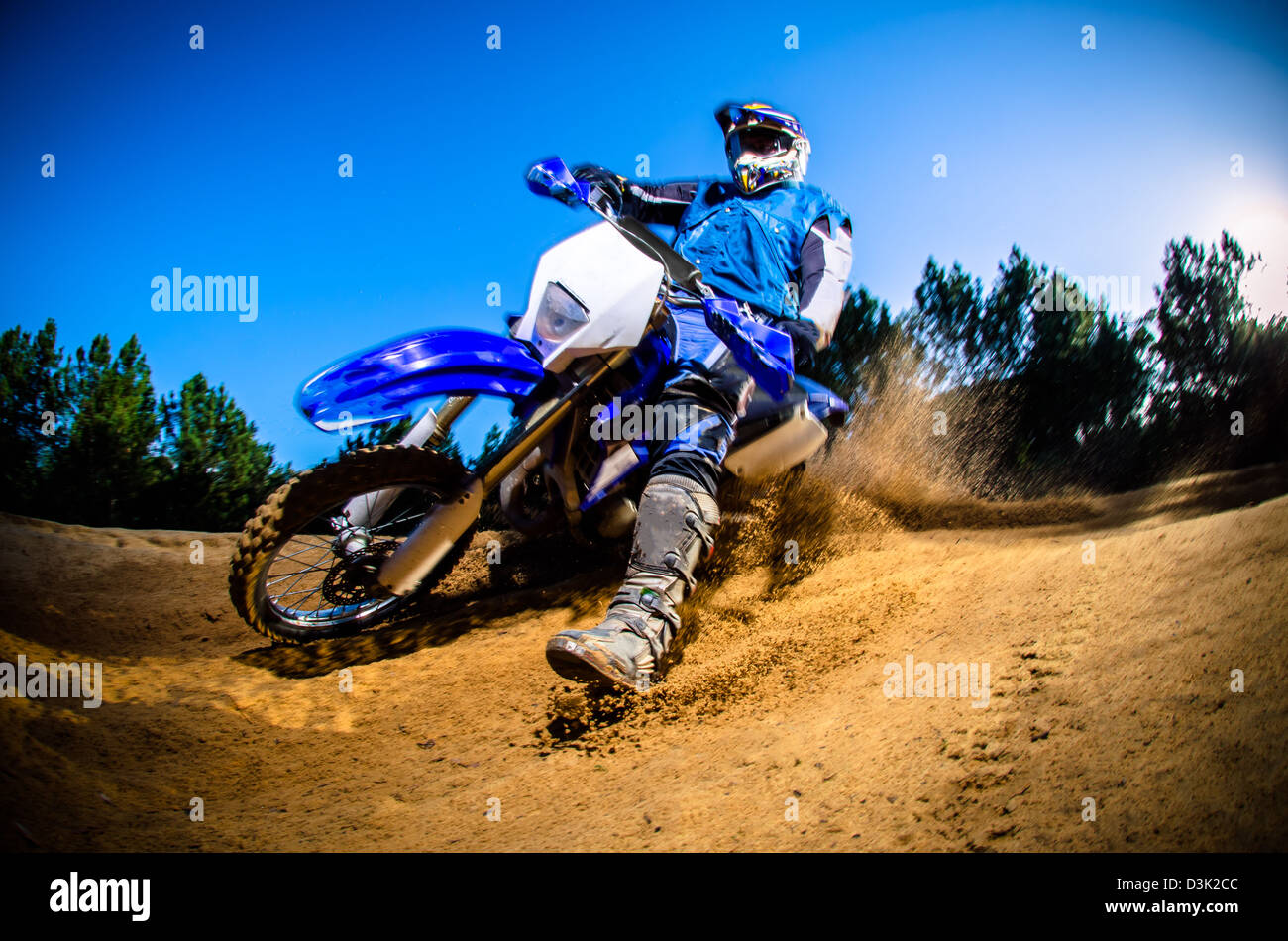 Enduro bike rider on action. Turn on sand terrain Stock Photo - Alamy