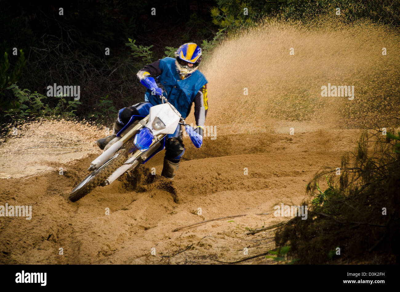 Enduro bike rider on action. Turn on sand terrain Stock Photo - Alamy