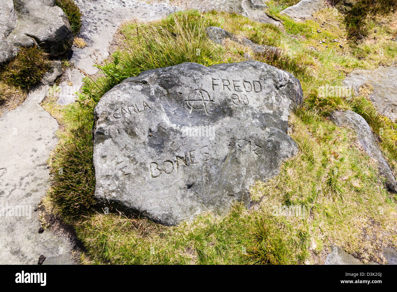 Carved names and symbols on rocks at Hangingstone Rocks Ilkley Moor ...