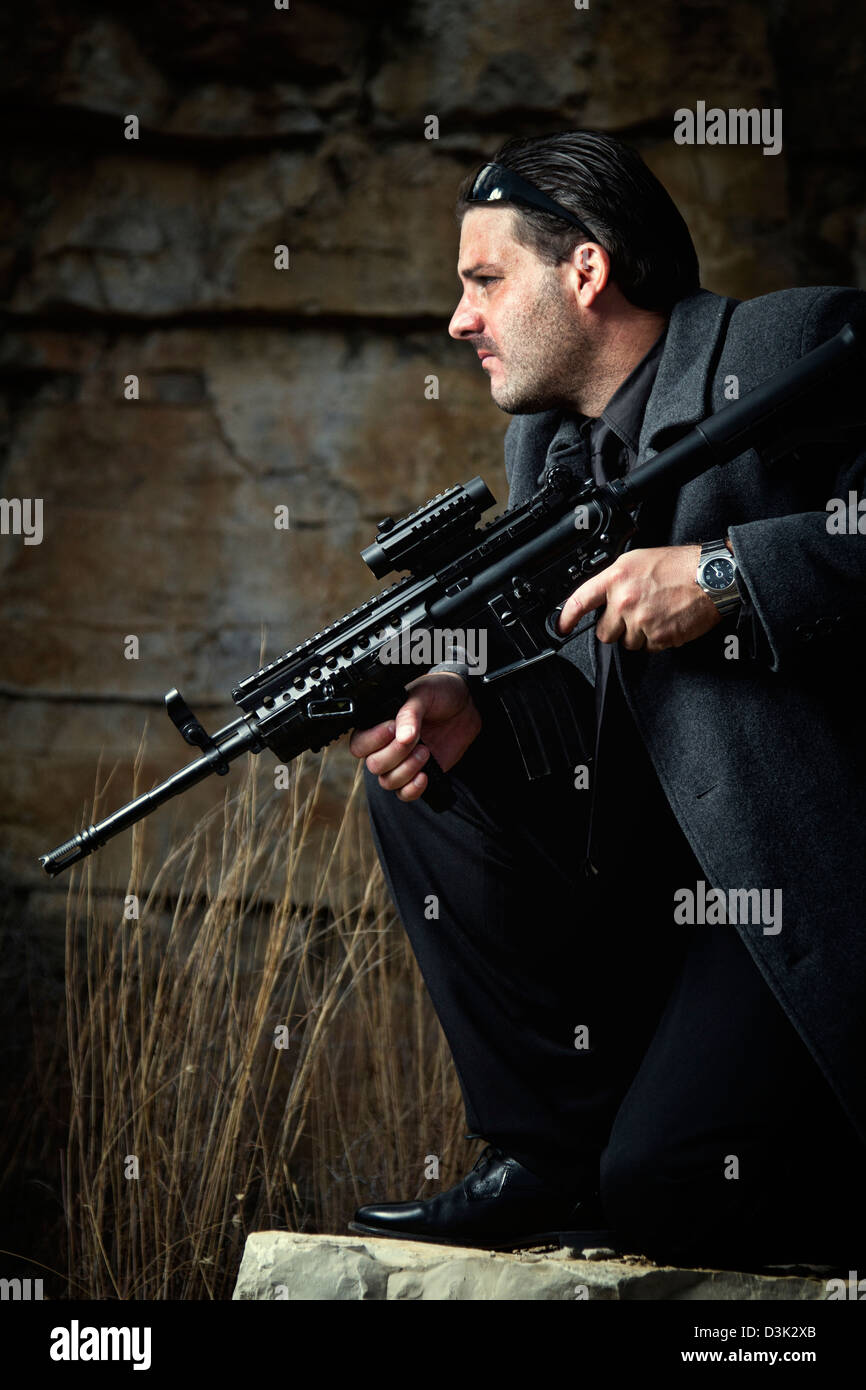 View of a contracted type killer agent wandering with a long jacket and ...