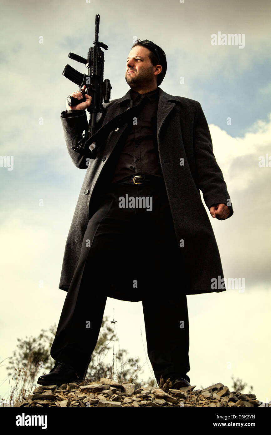 View of a contracted type killer agent wandering with a long jacket and ...