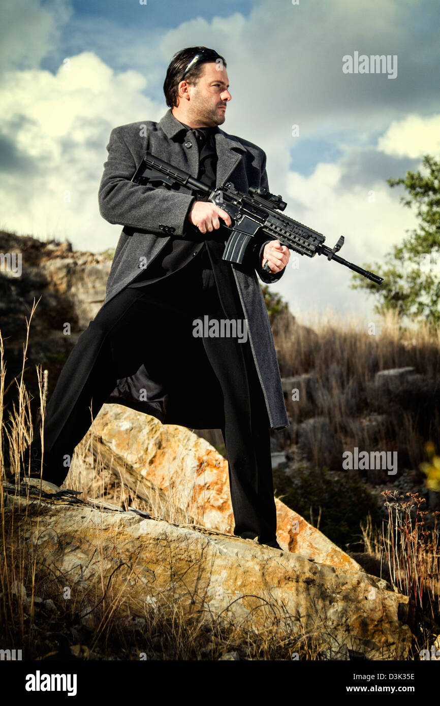 View of a contracted type killer agent wandering with a long jacket and ...