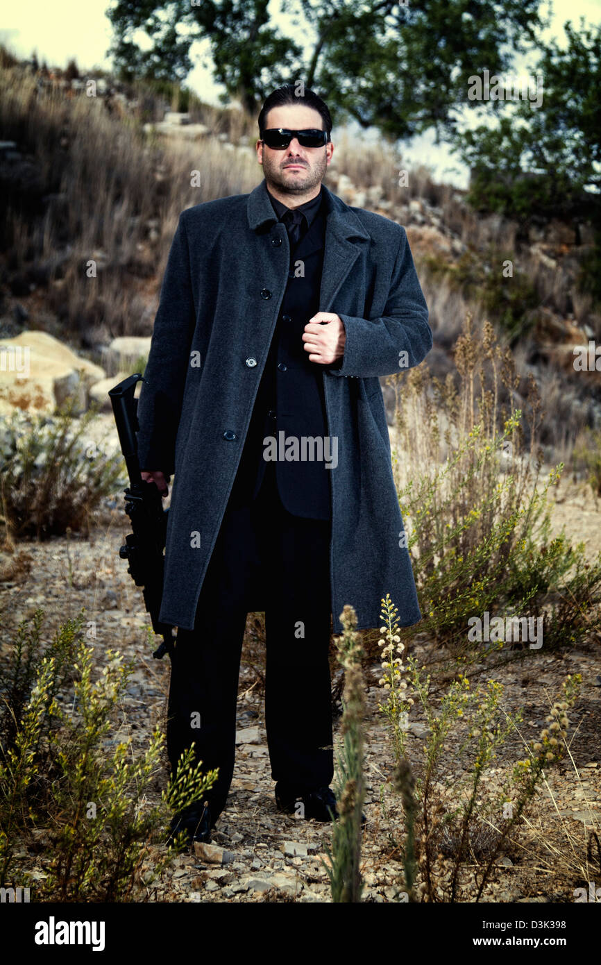 View of a contracted type killer agent wandering with a long jacket and ...