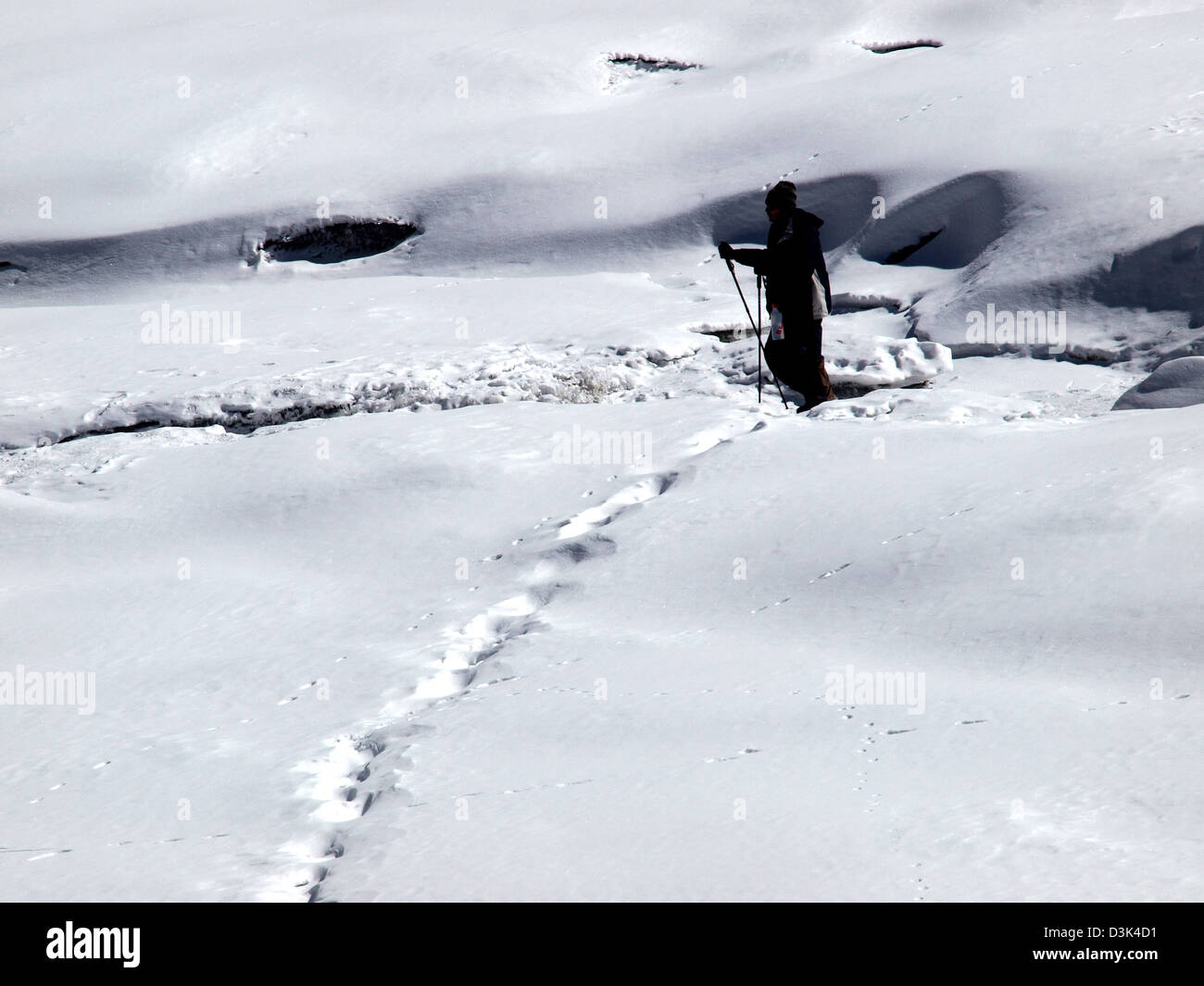 Man climbing Chola Pass in the snow on everest base camp trek in the ...