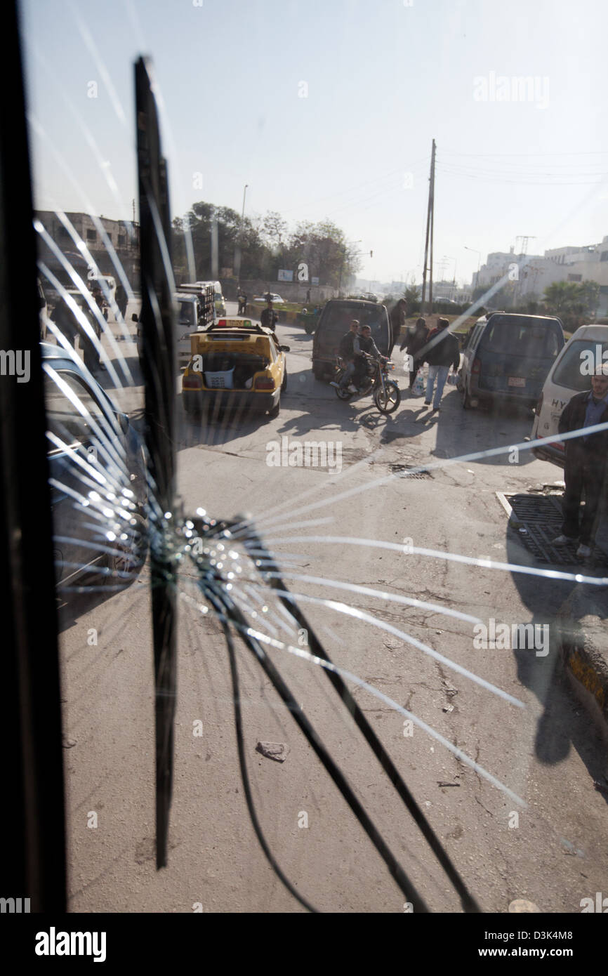 Aleppo, Syria: People ride a public bus. Services are limited with only ...