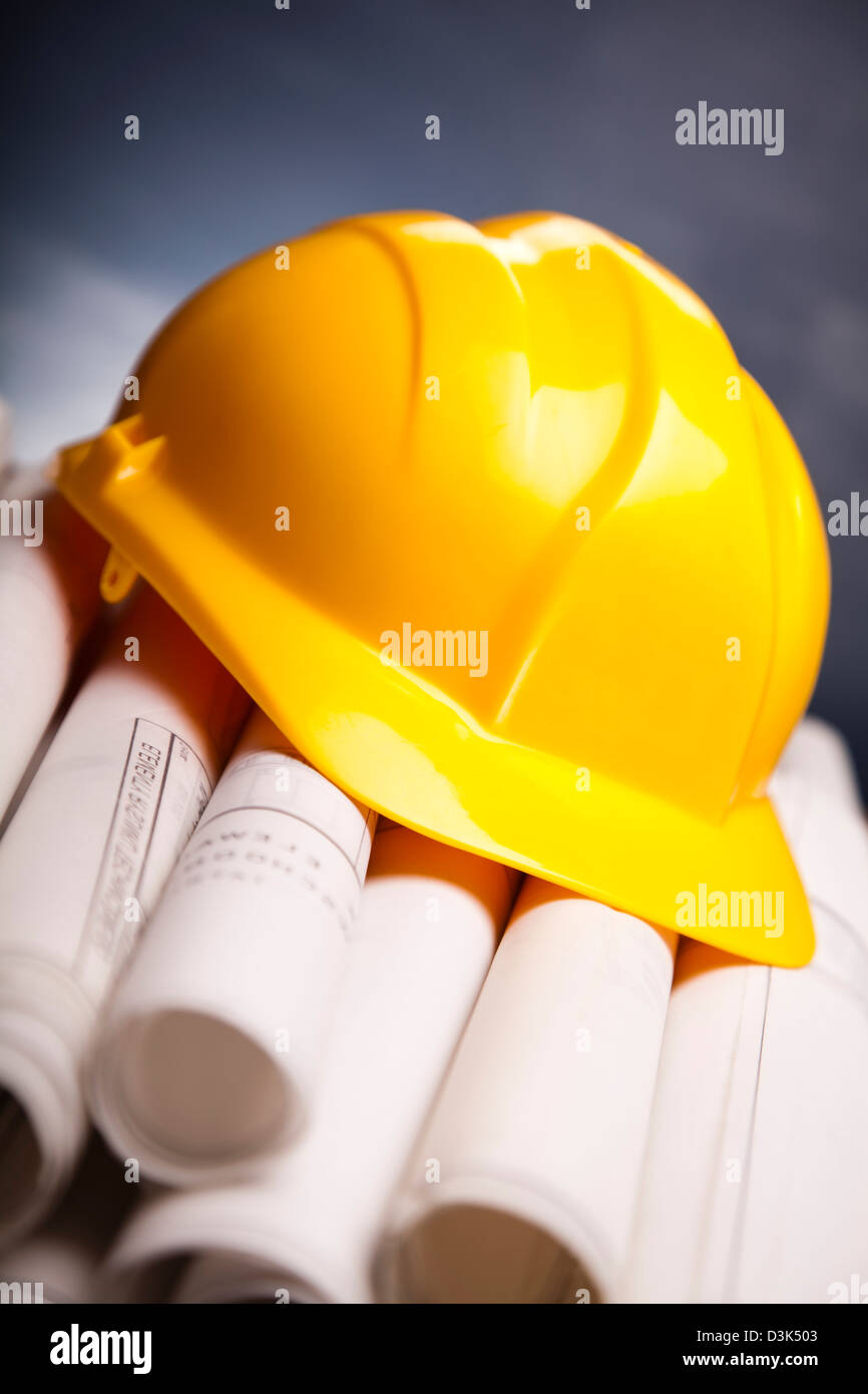 Construction Plans and yellow hard hat Stock Photo - Alamy