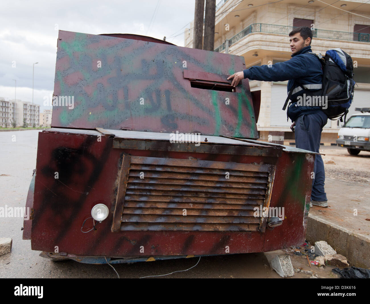 Free Syrian Army fighters inspect a homemade tank. It was designed for ...