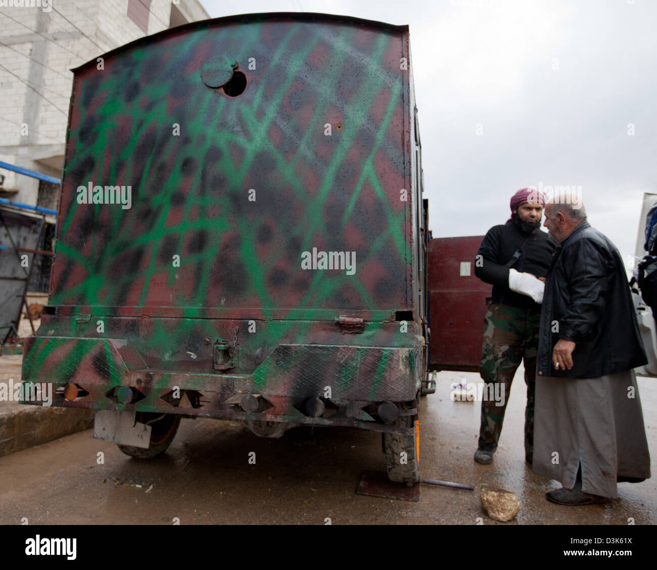 Free Syrian Army fighters inspect a homemade tank. It was designed for ...