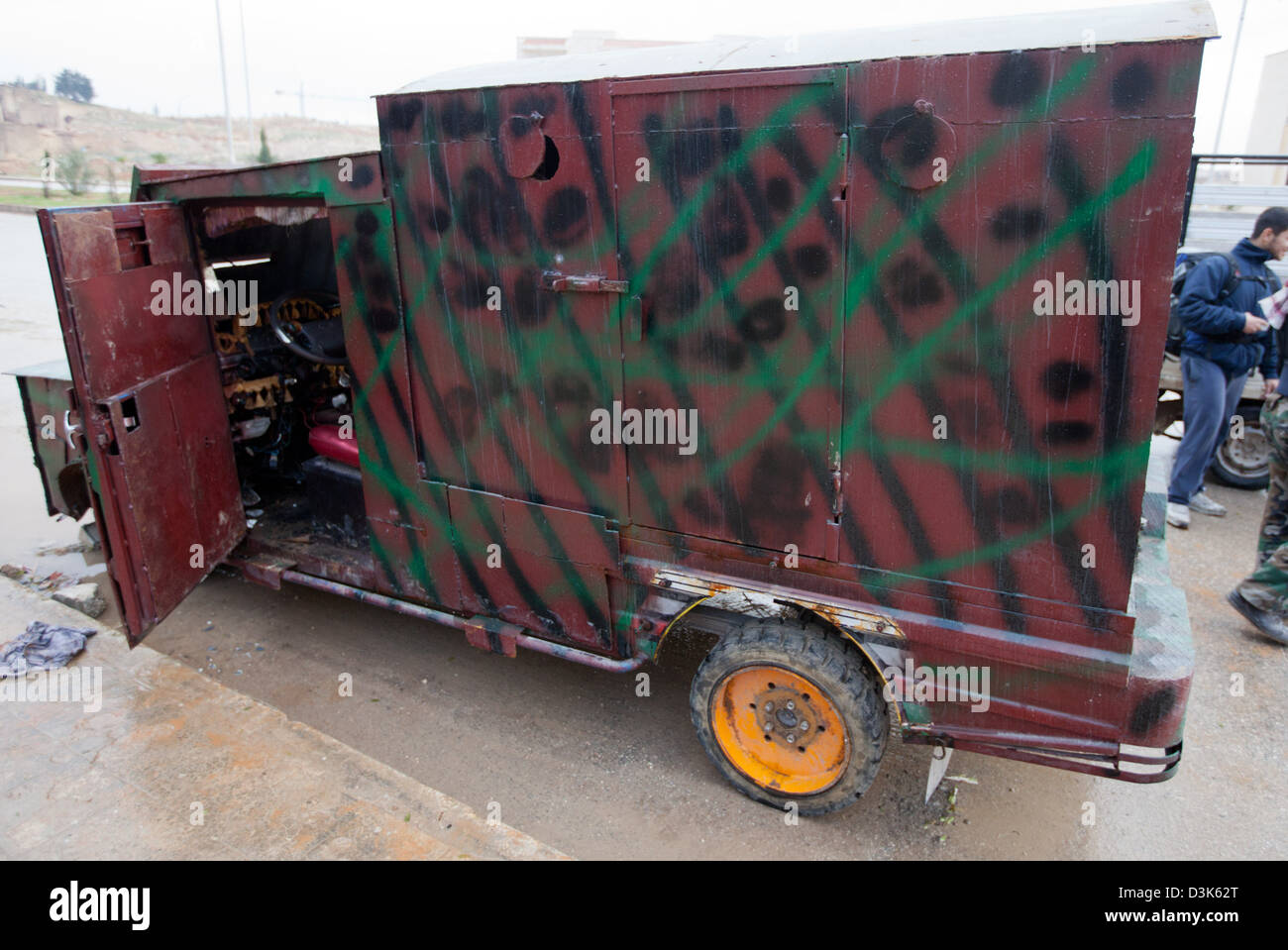 Free Syrian Army fighters inspect a homemade tank. It was designed for ...