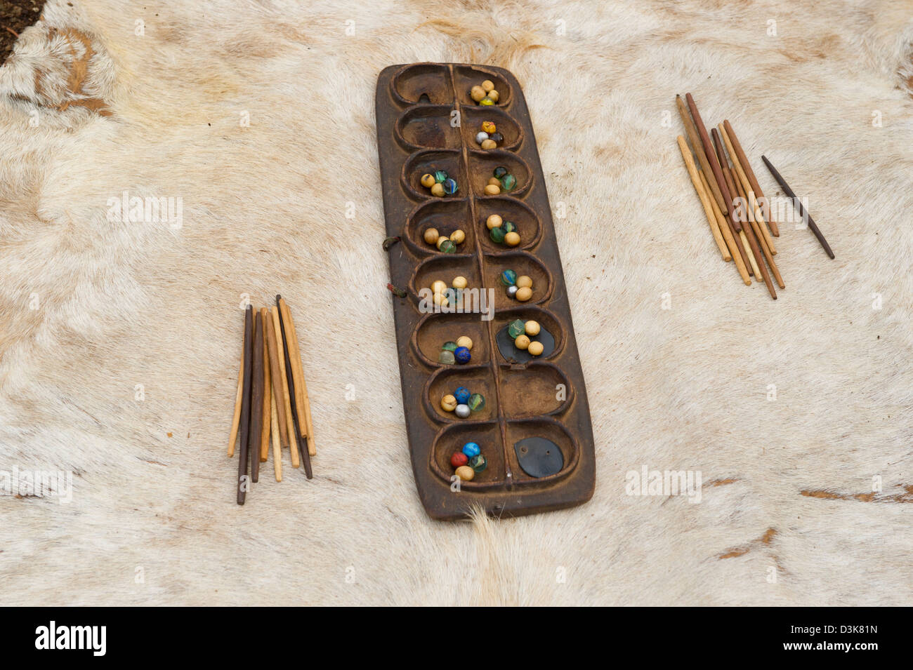 Enkeshui board, mankala game played by the Maasai, Selenkay Conservancy ...