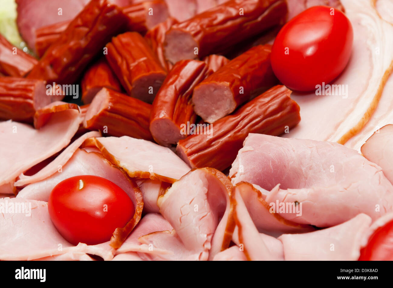 platter of cold cuts and sausages with ham and tomatoes Stock Photo - Alamy