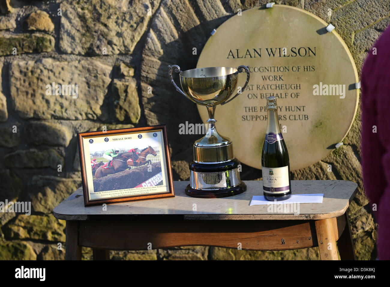 Presentation table with Champagne, Cup and framed photograph Stock ...