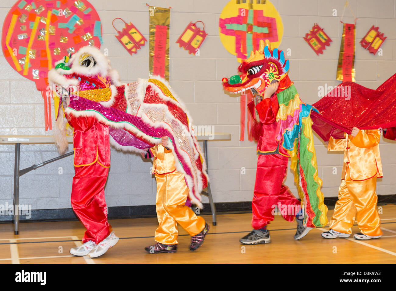 Children performing lion and dragon dance at chinese new year ...