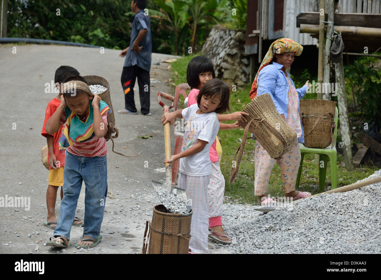Bidayuh children helping with a community project Stock Photo - Alamy