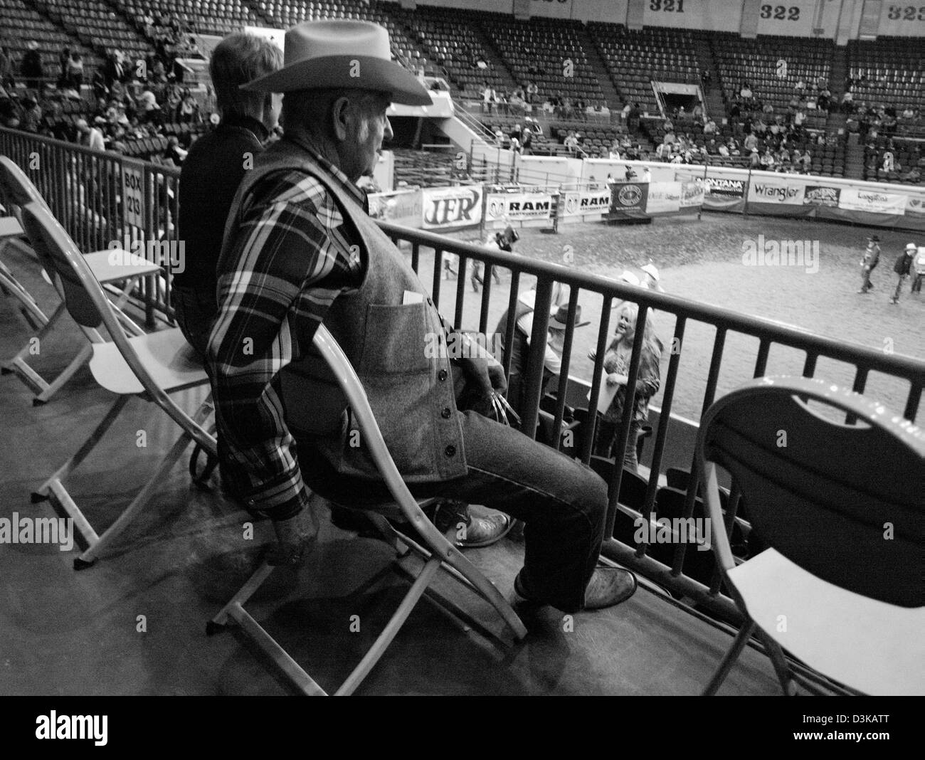 Cowboy watching the National Finals Rodeo in Oklahoma City, Oklahoma ...