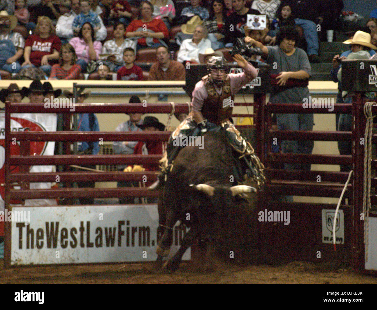 Cowboy riding bucking bull during the National Finals Rodeo in Oklahoma ...