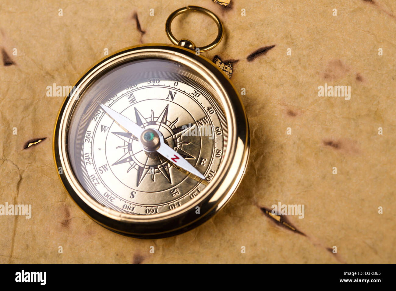Compass on the old map background Stock Photo - Alamy