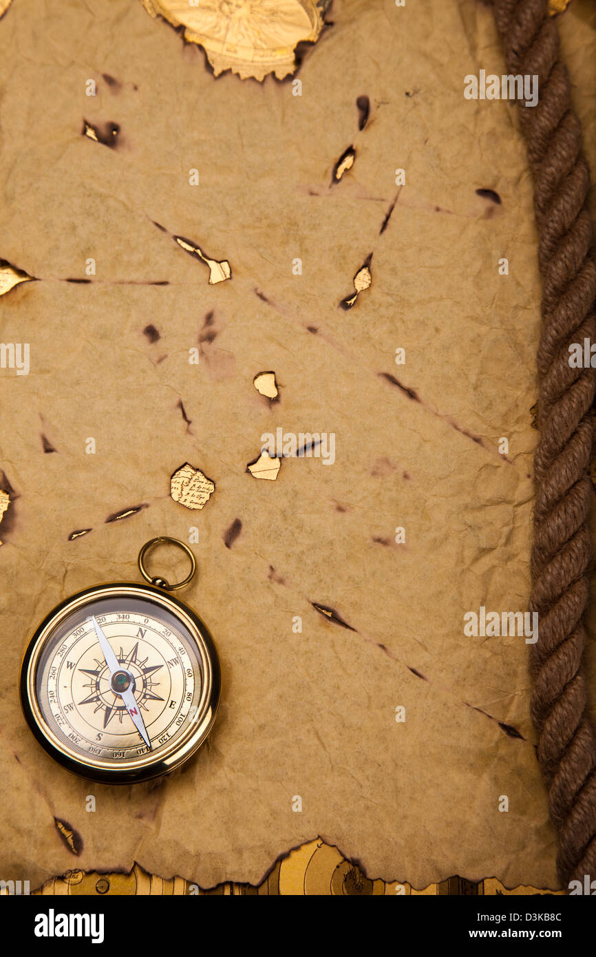 Old style compass and paper background Stock Photo - Alamy