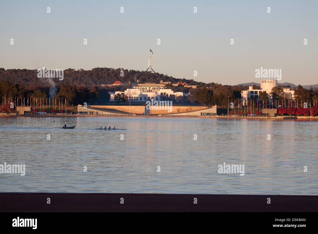 Rowing team training on Lake Burley Griffin in front of the Provisional Parliament House ...