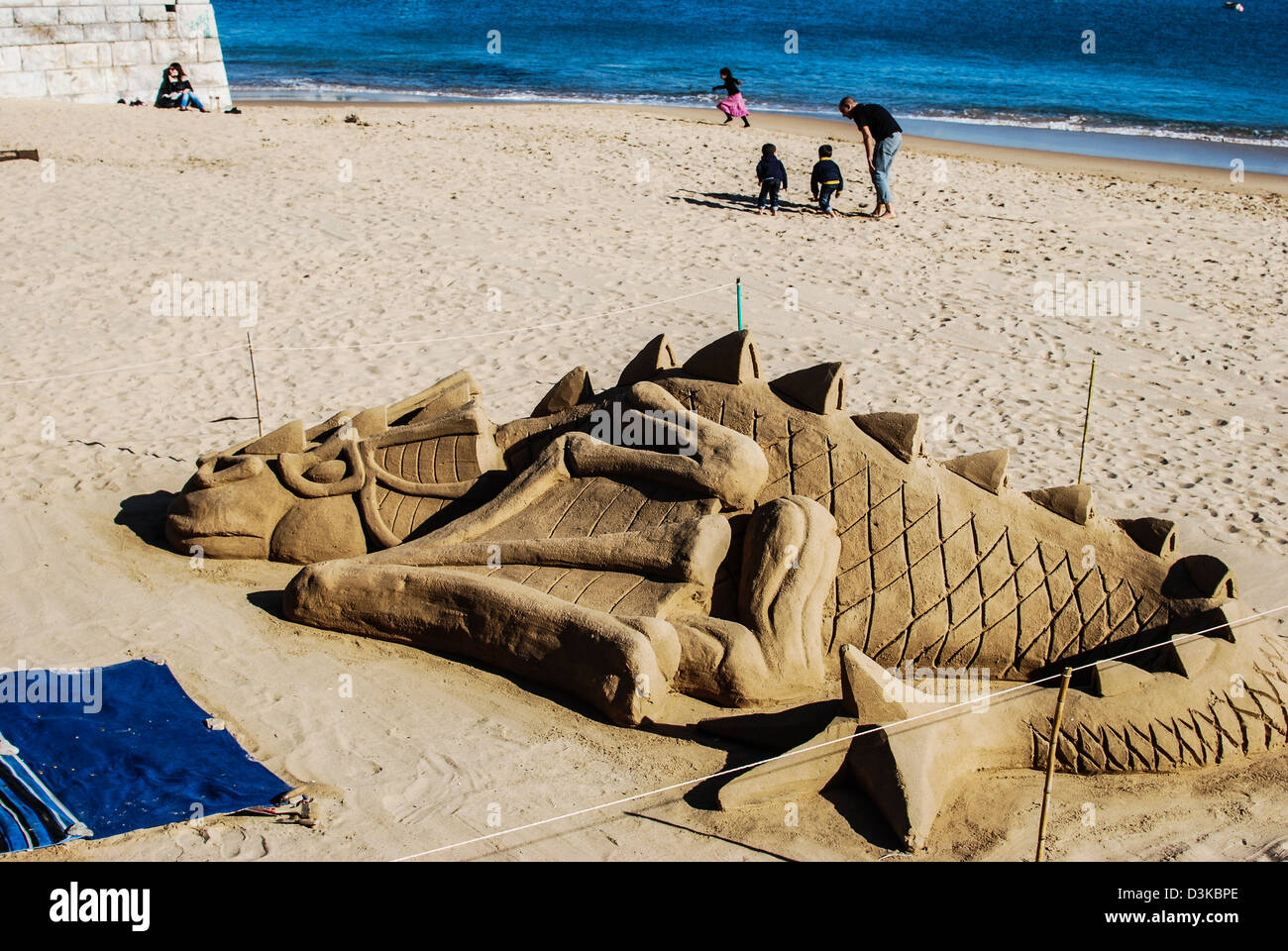 Dragon sandcastle sculpture in Cascais Portugal Stock Photo - Alamy