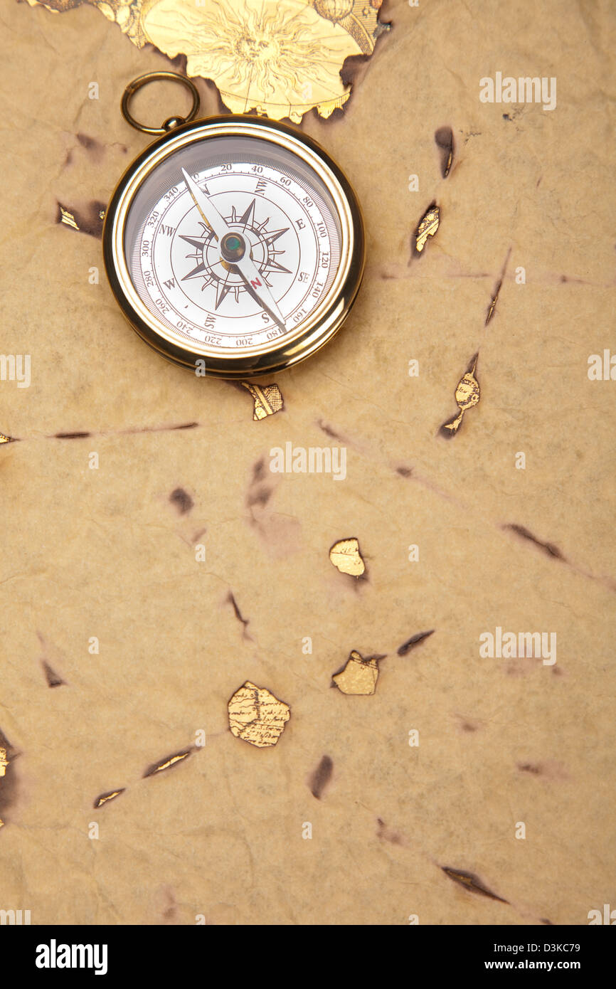 Old style compass and paper background Stock Photo - Alamy