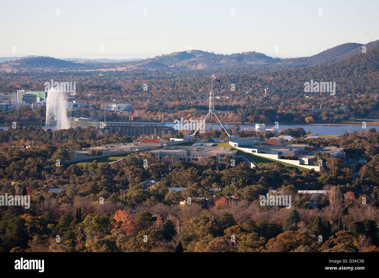 Sunset over Parliament House Canberra Australia surrounded by autumn ...