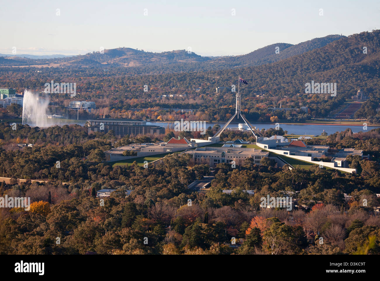Sunset over Parliament House Canberra Australia surrounded by autumn ...
