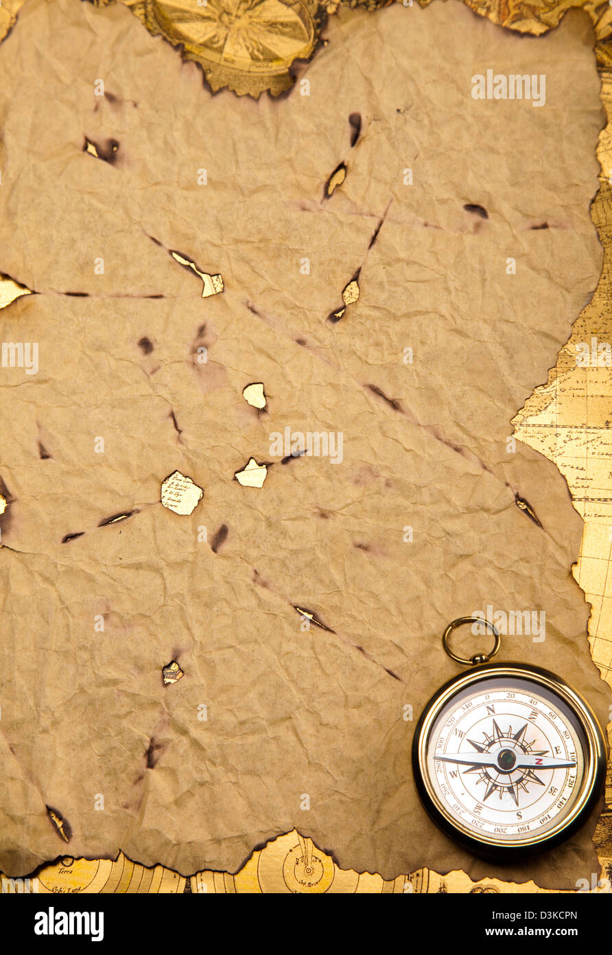 Old style compass and paper background Stock Photo - Alamy