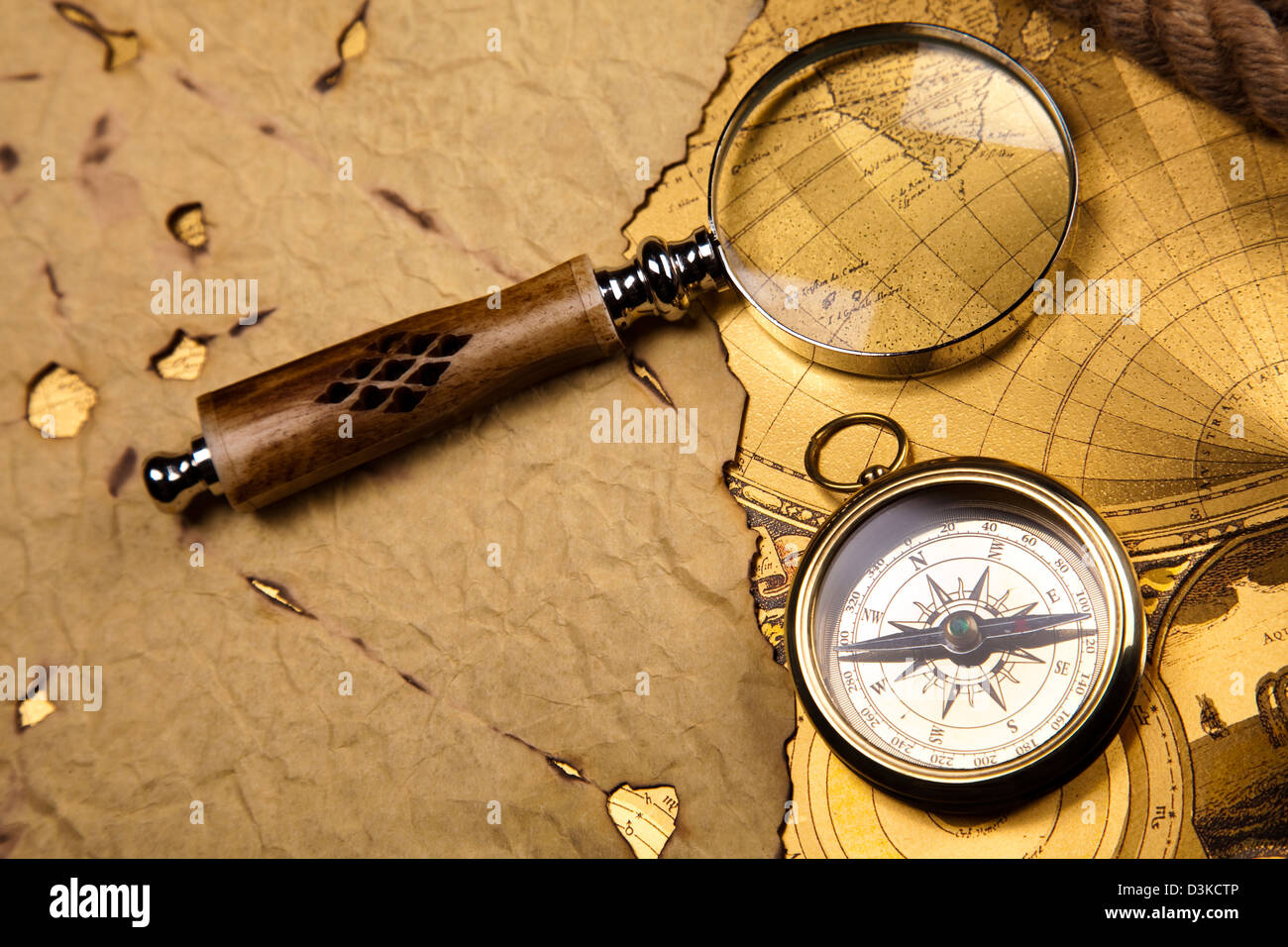 Magnifying glass and Compass Stock Photo - Alamy
